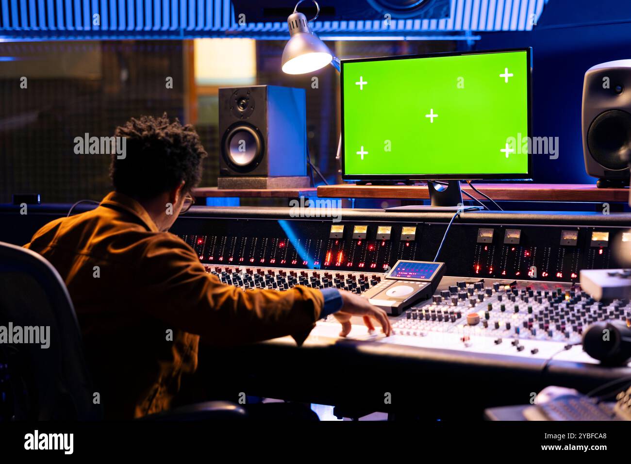 African american audio technician works with mockup layout on pc ...