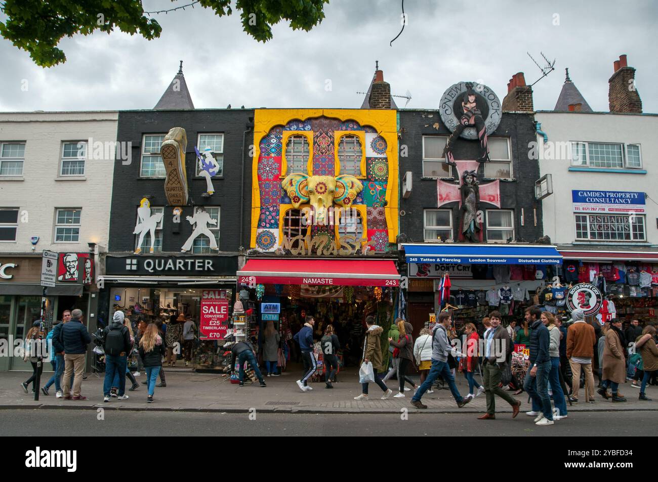 Camden High Street, pedestrians strolling on a grey spring day along ...