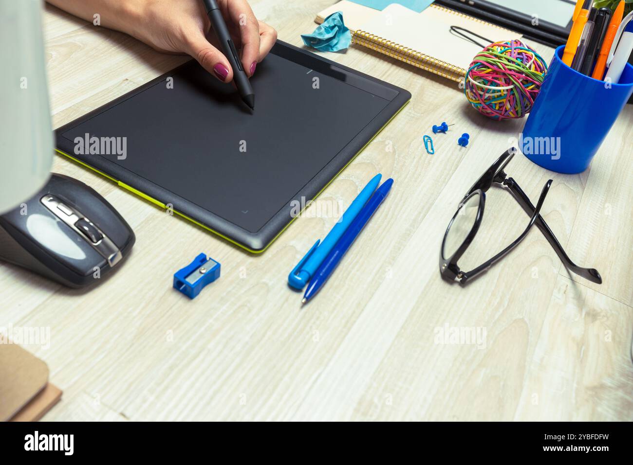 Hand of graphic designer working with stilus and tablet Stock Photo - Alamy