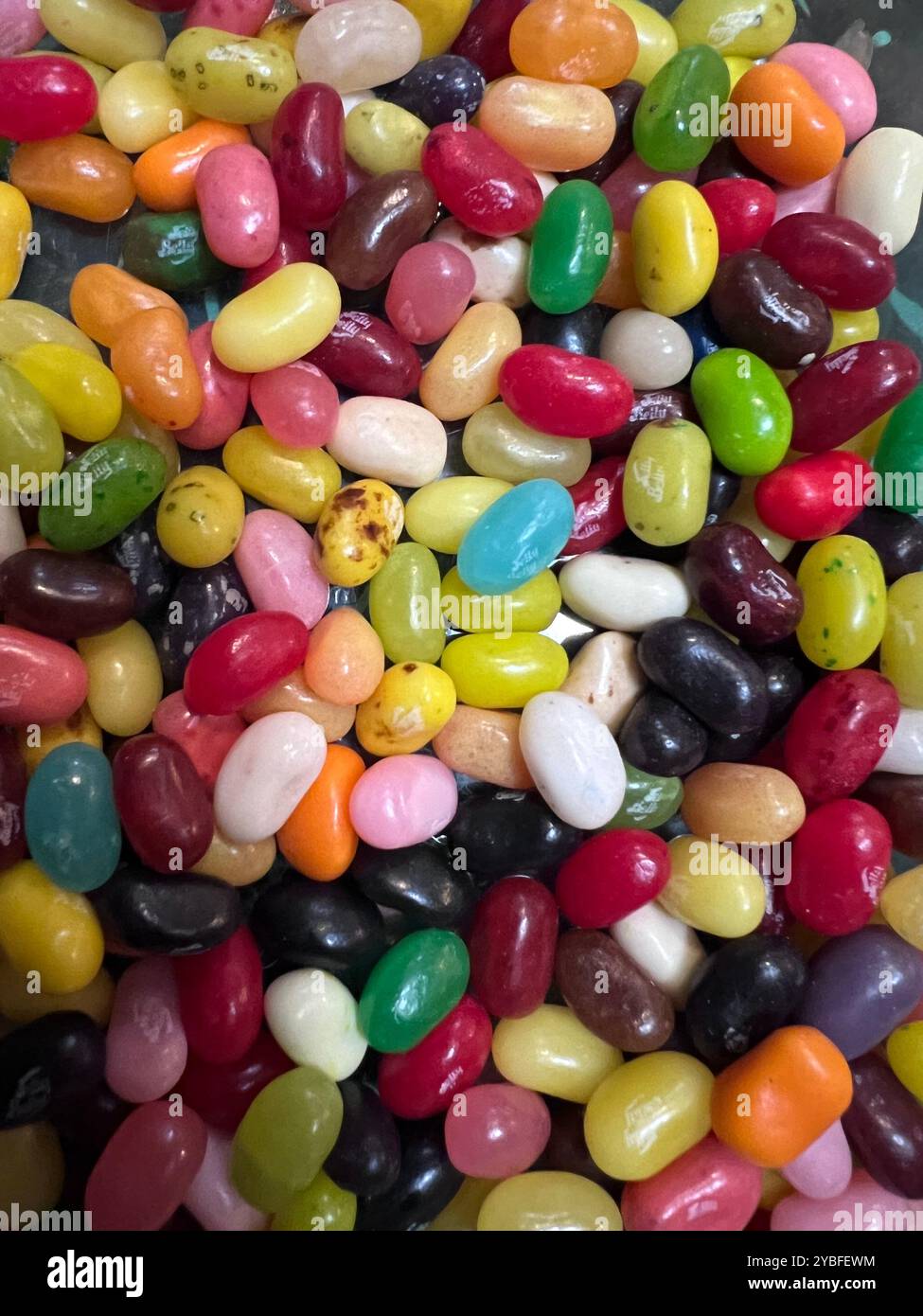 An array of jelly beans in a multitude of colors fills the frame ...