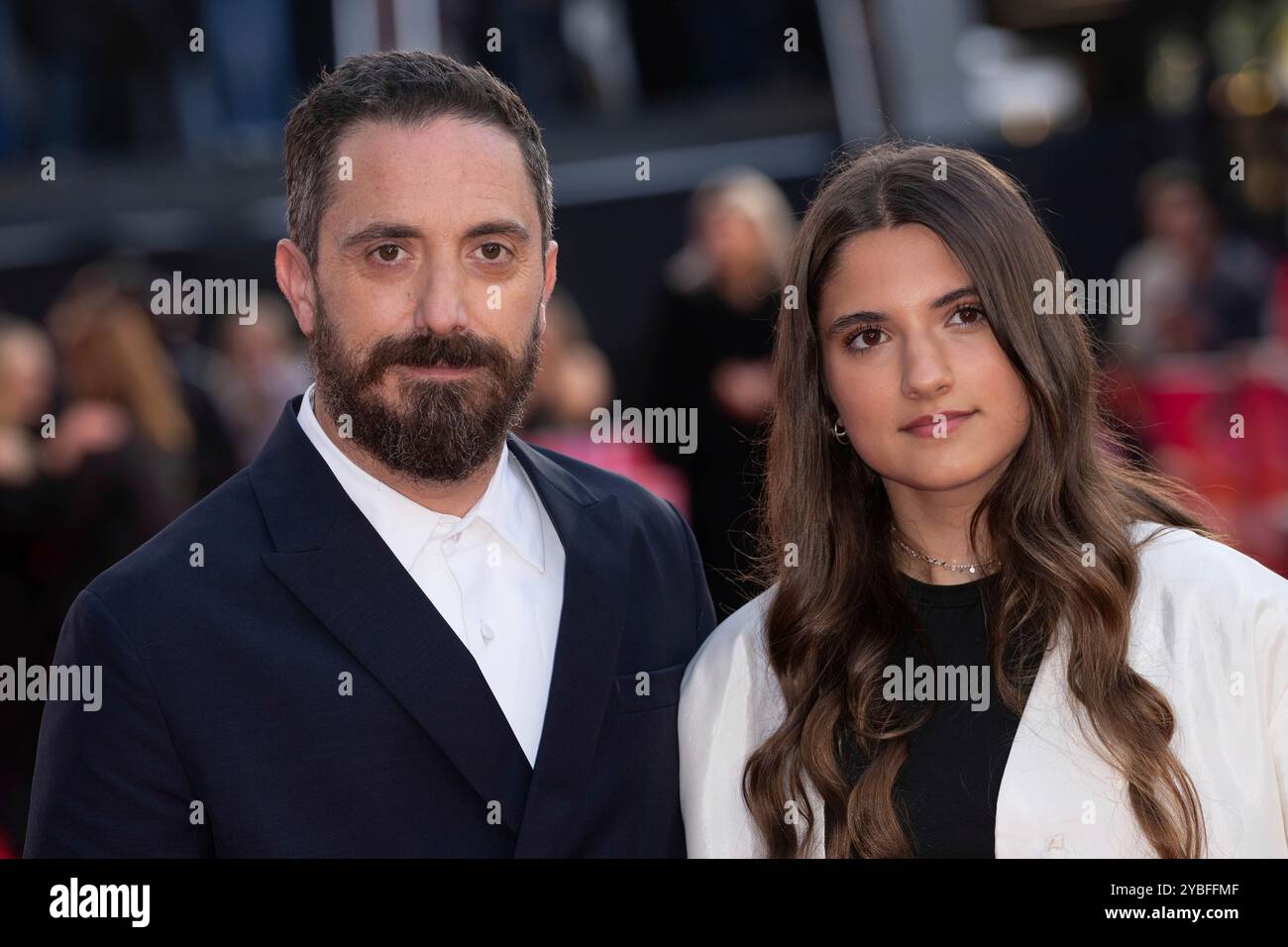 Pablo Larrain, left and his guest pose for photographers upon arrival ...