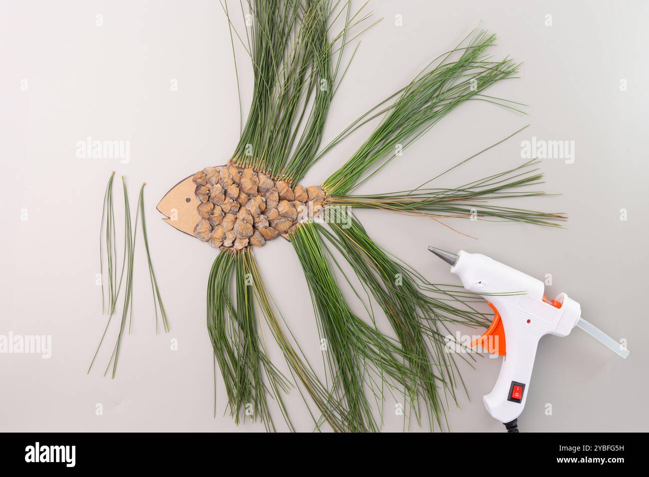 preschool hour teaching activity, fish toy made of pine cone needles ...