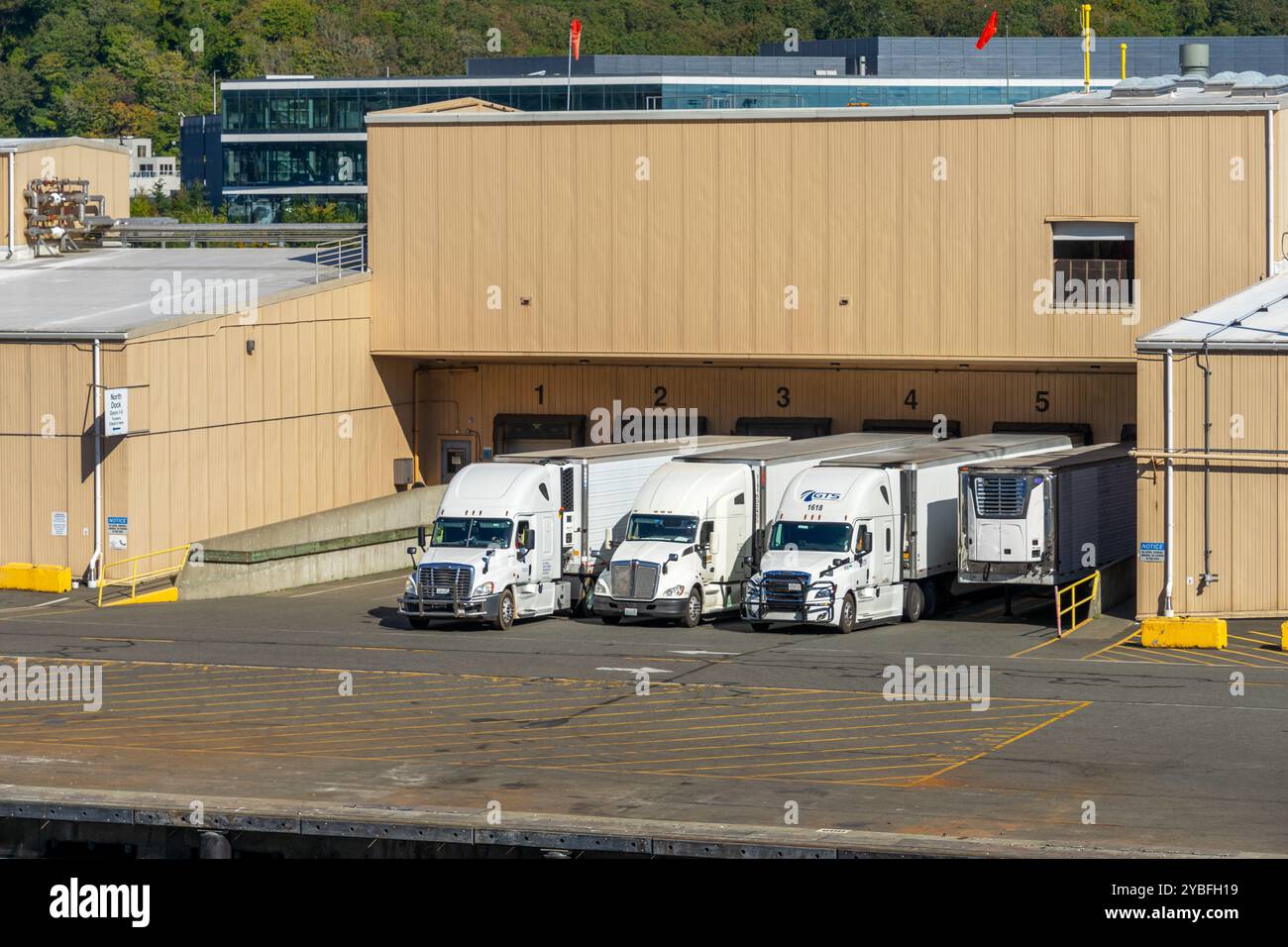 Seattle, Washington, USA - September 20, 2024: Semi trucks backed in a ...