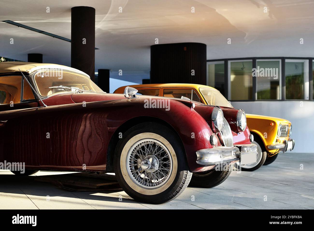 The vintage Jaguar car in the parking lot of the Narkomfin House is one ...