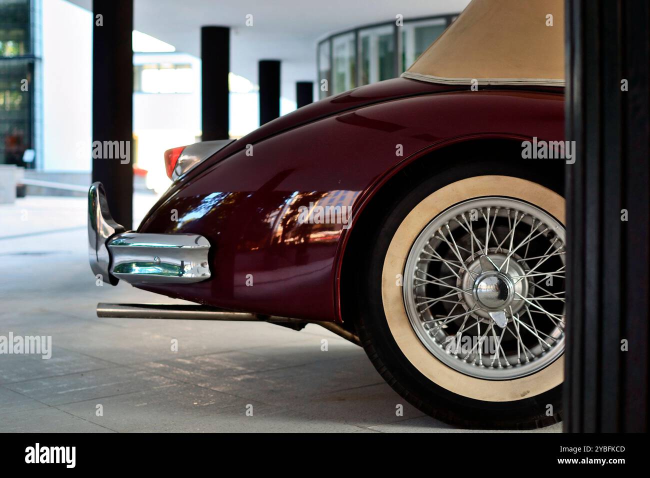 The vintage Jaguar car in the parking lot of the Narkomfin House is one ...