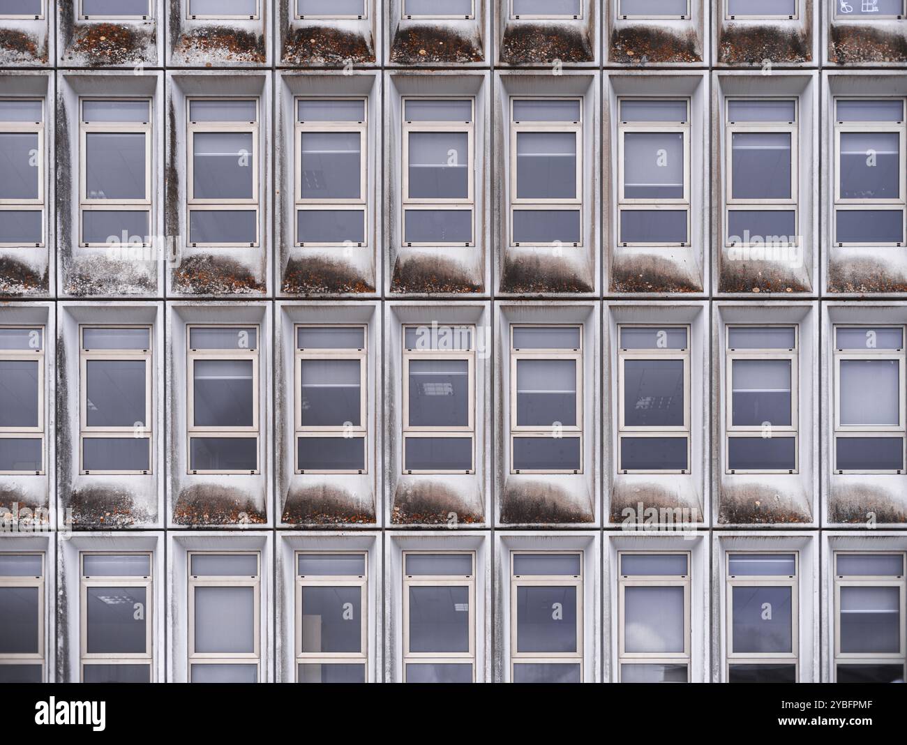 Close-up view of a modern building facade with repetitive grid of ...