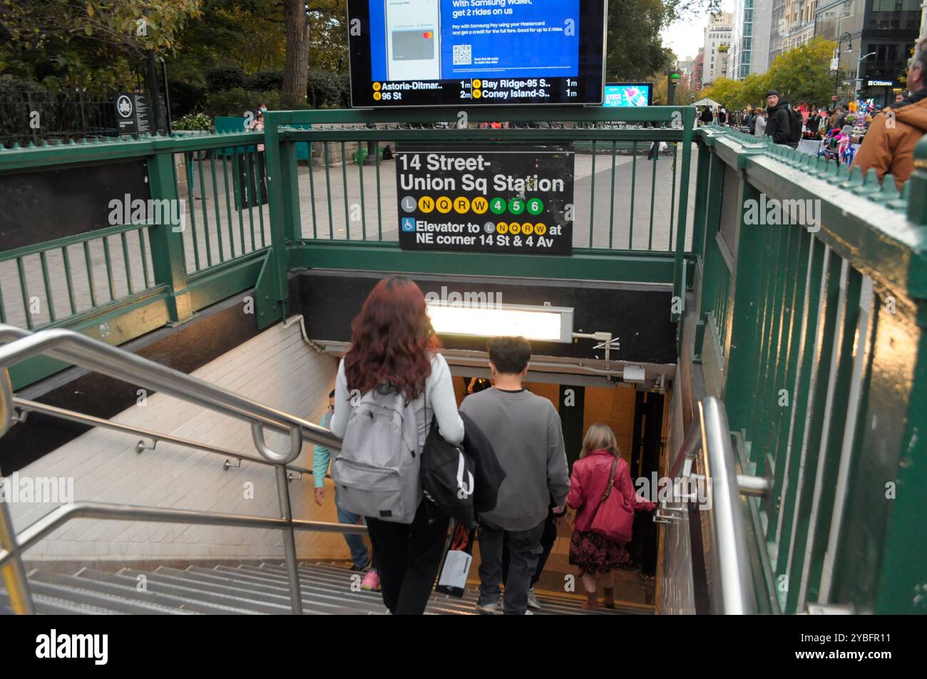 People walk down the 14th Street, Union Square subway station in Manhattan, New York City Stock ...