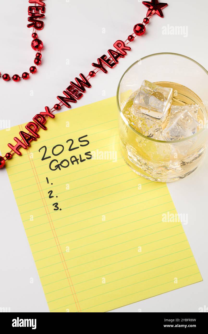2025 goals yellow lined paper to fill in with drink and red beads Stock ...