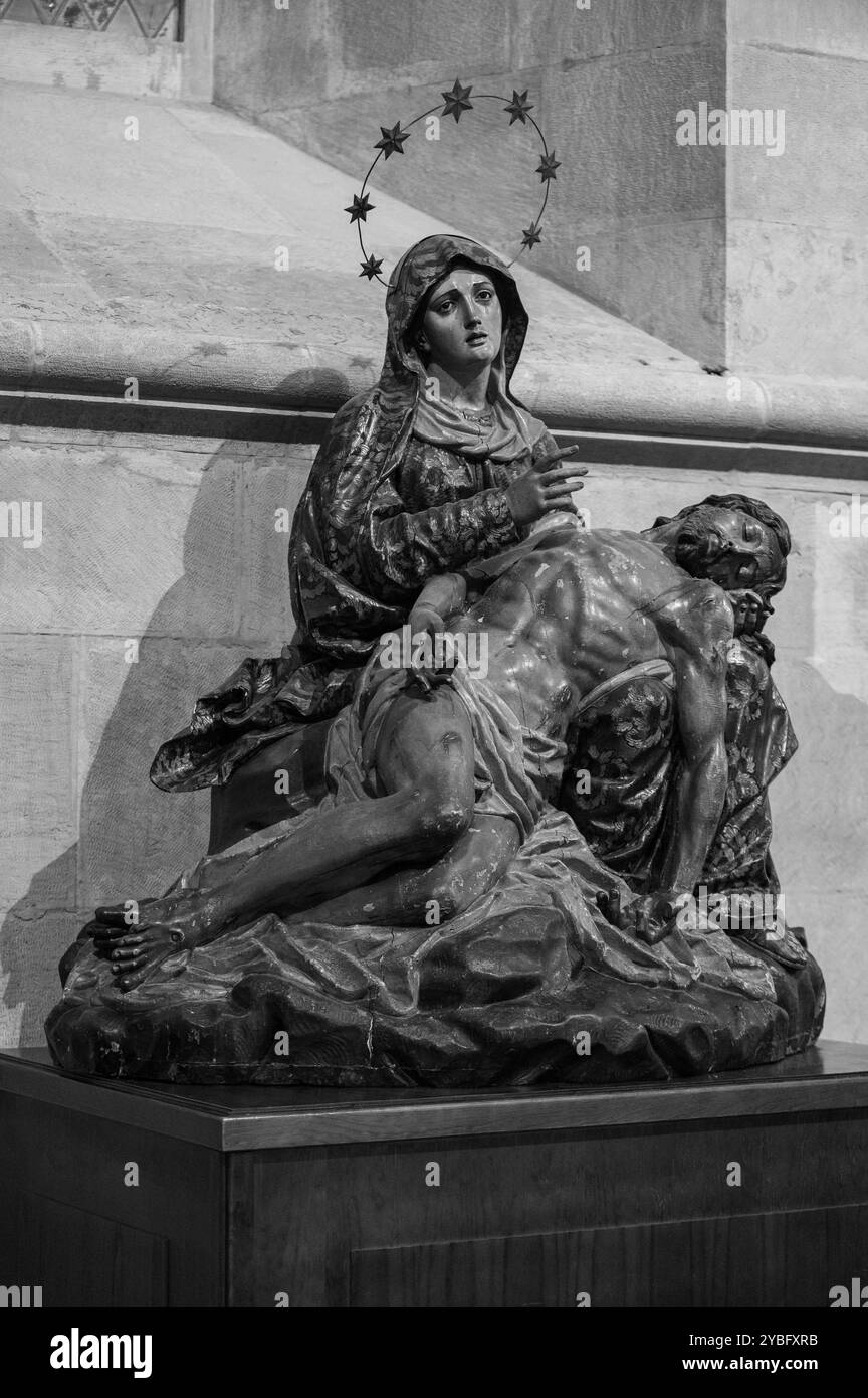The Pietà – the Virgin Mary tenderly cradling the lifeless body of her ...