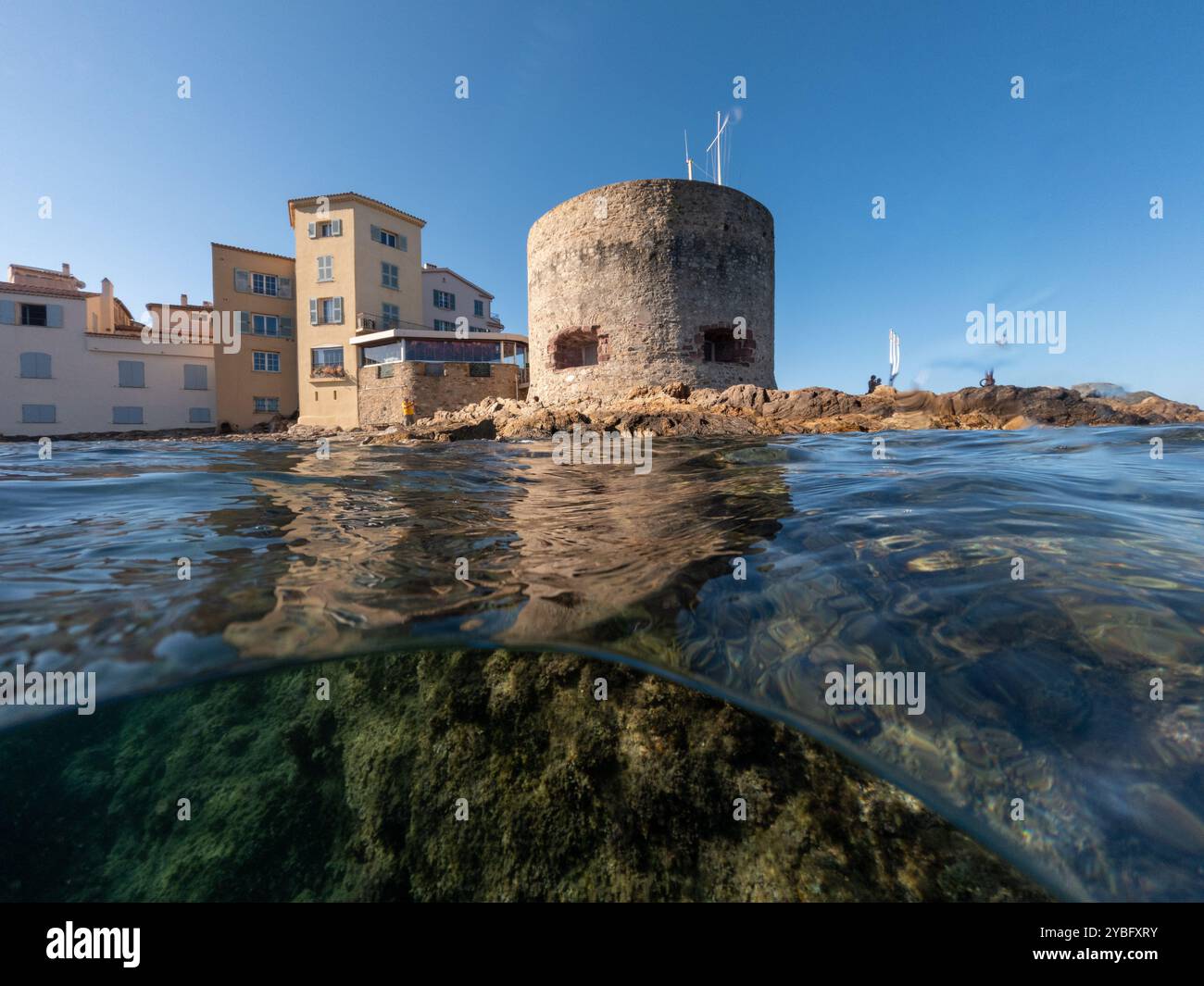Half water, half air photography of the facades and old tower of la ...