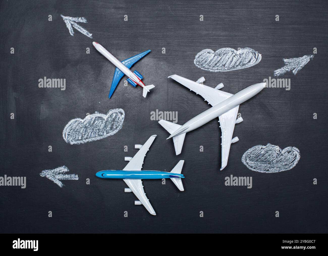 toy airplane over chalkboard background and arrows drawings Stock Photo ...