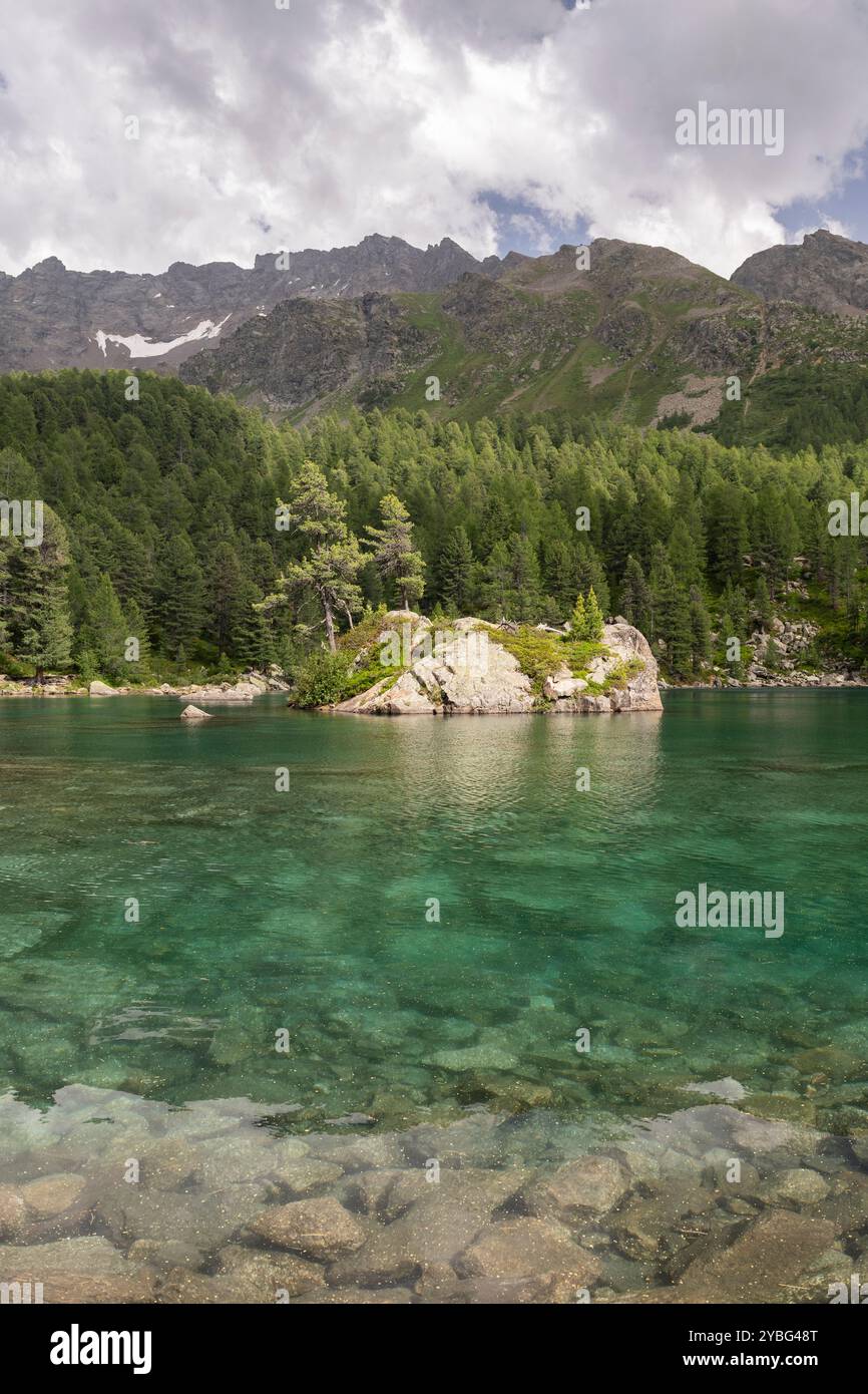 Scenic Alpine View of Lake Saoseo with Reflections and Rugged Mountain ...