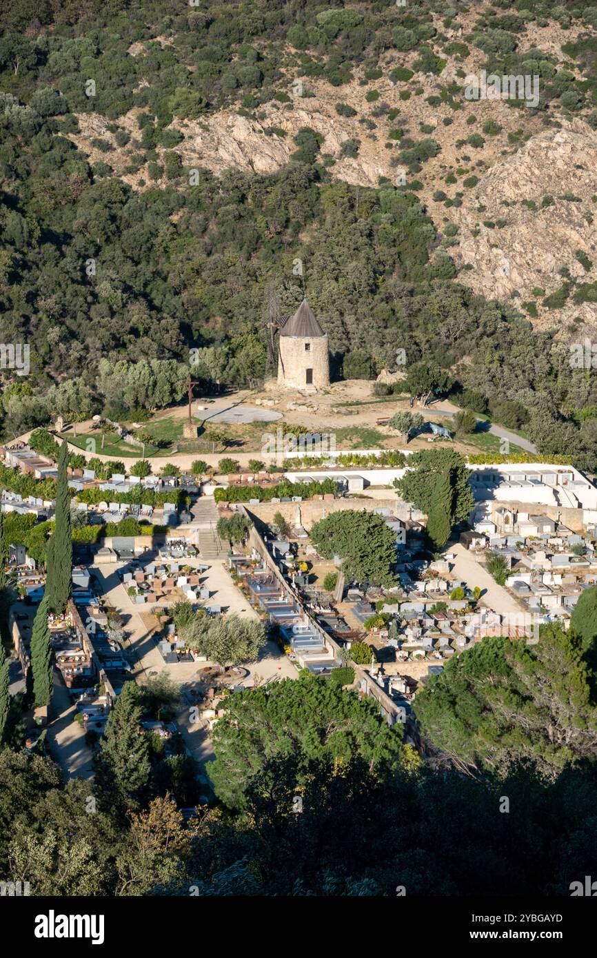 Saint-Roch windmill and cemetery at the top of a hill in Massif des ...