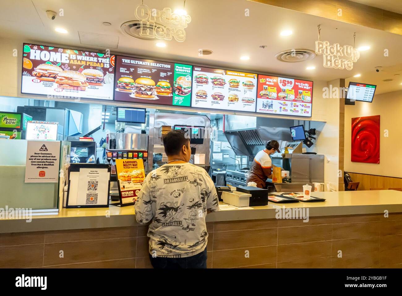 A customer at the counter in Burger King cafe, Tiong Bahru Singapore ...