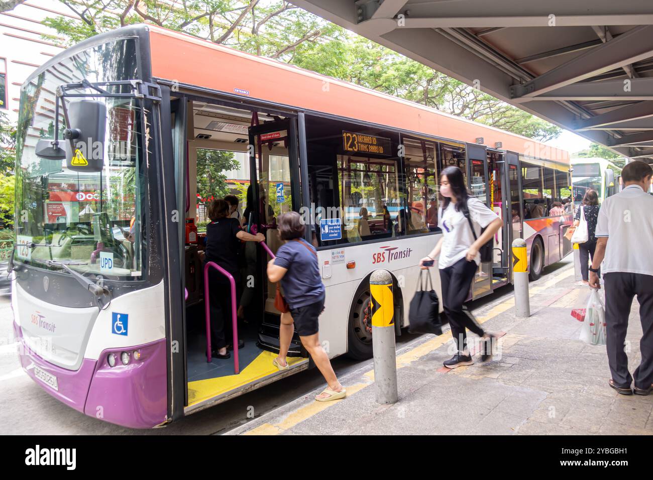 Passengers boarding city bus, Tiong Bahru district Singapore Stock ...