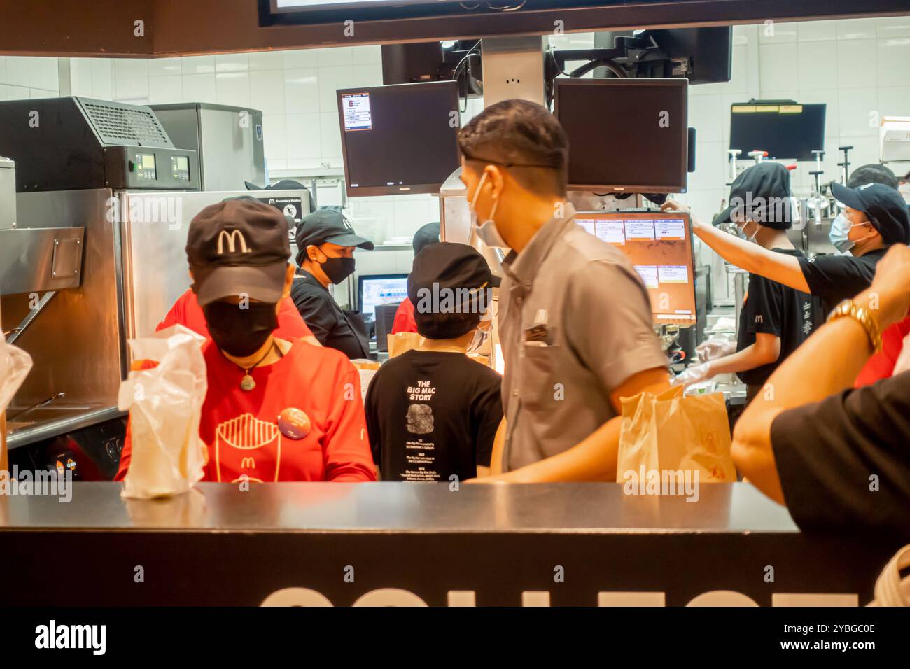McDonalds restaurant counter and kitchen, staff, employees, working ...