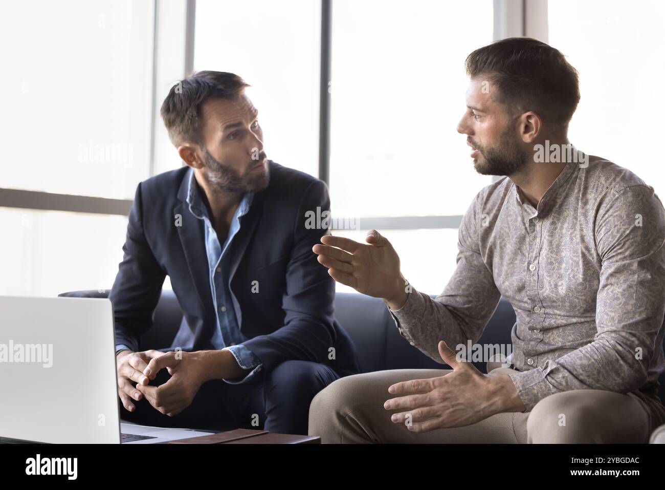 Two people talking serious hi-res stock photography and images - Alamy