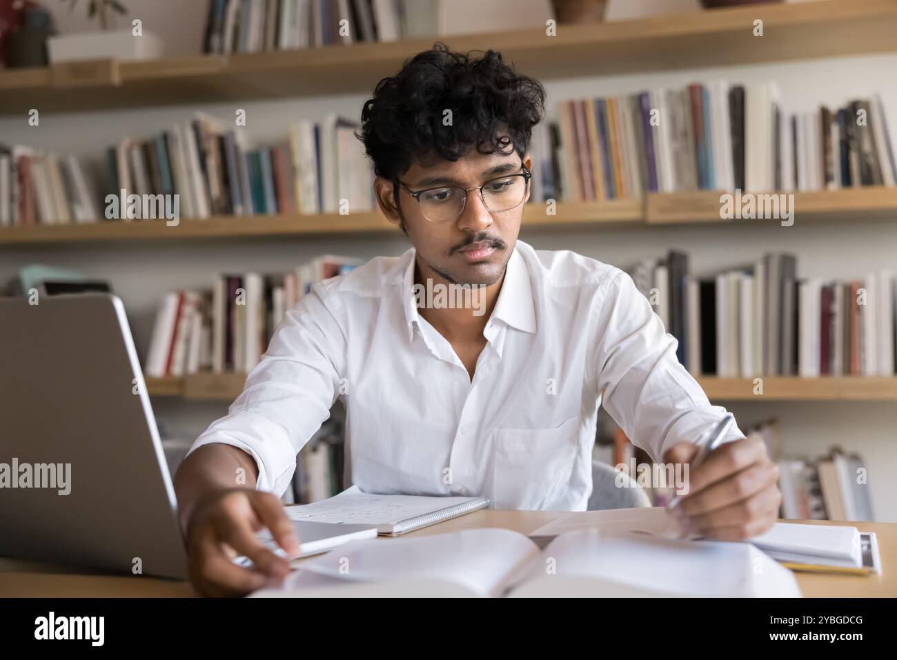 Serious smart indian student guy hi-res stock photography and images ...