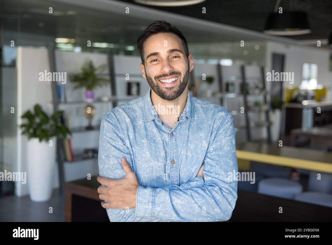 Happy business owner man, company founder standing with arms folded ...