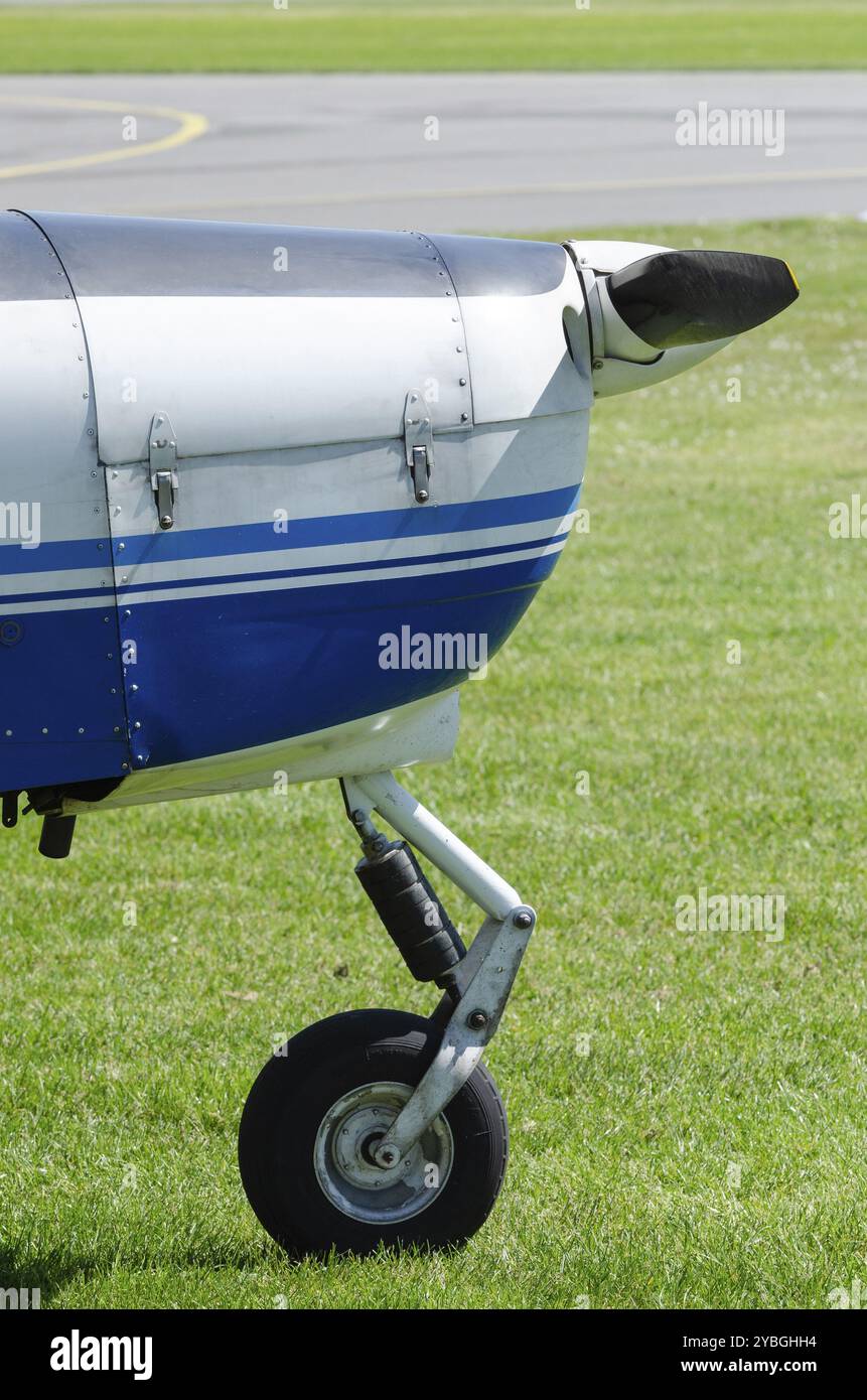 Nose with nose wheel of a single-engine plane on a small sport airfield ...