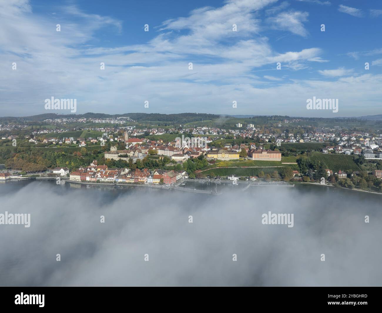 Aerial view of Meersburg and the harbour promenade in autumn fog, Lake ...