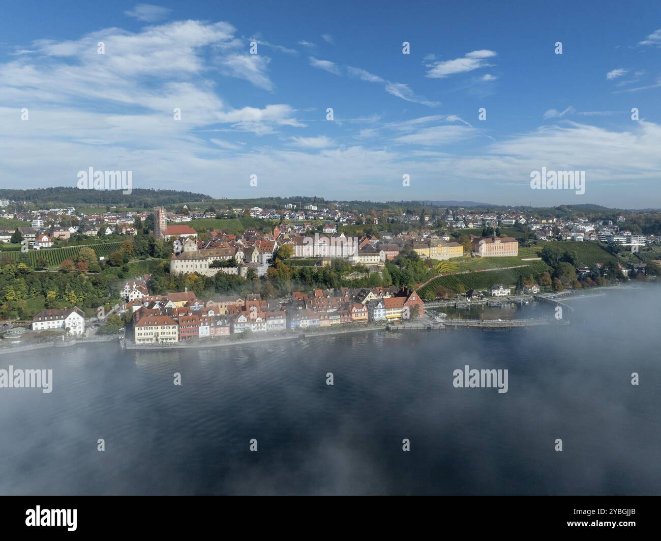 Aerial view of Meersburg and the harbour promenade in autumn fog, Lake ...