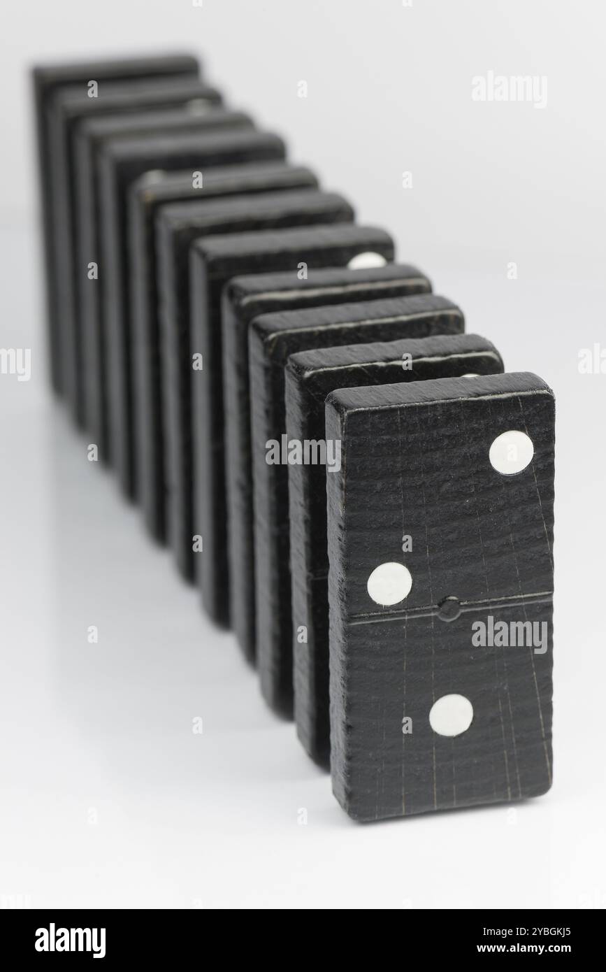 Composition of standing black domino bricks with white dots Stock Photo ...