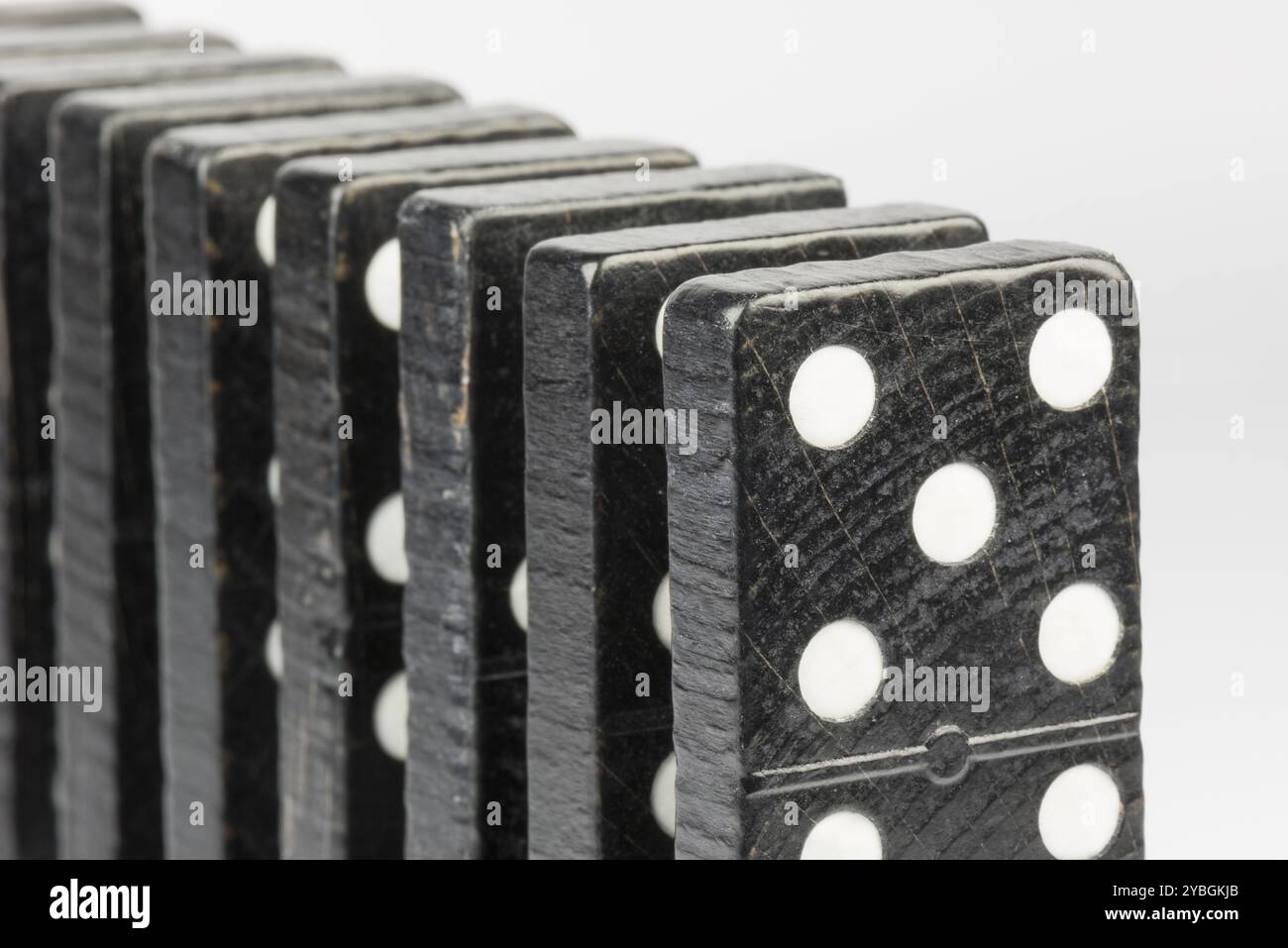 Composition of standing black domino bricks with white dots Stock Photo ...