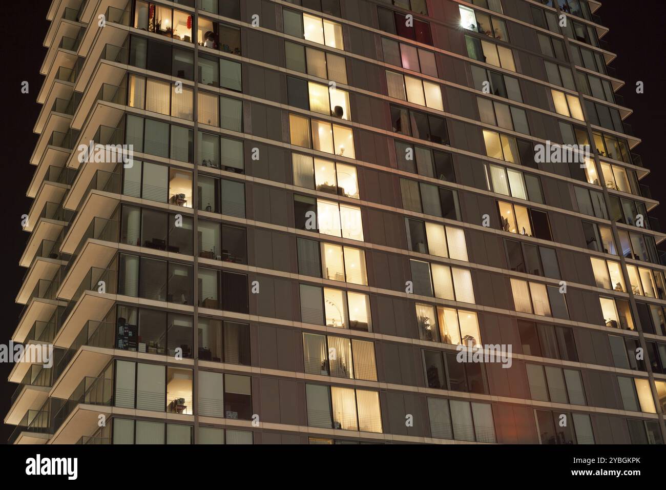 Modern apartment block at night Stock Photo - Alamy