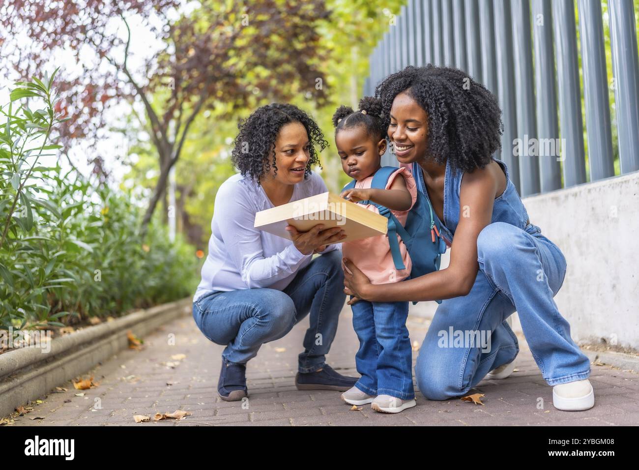 African female family of two generations having fun at the end of a ...