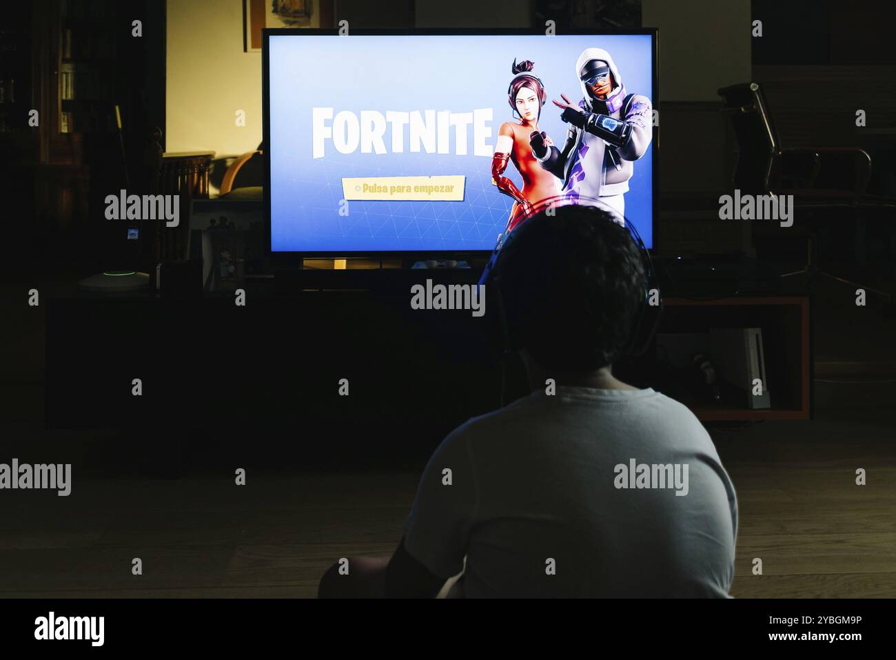 Madrid, Spain, May 29, 2019: Teenager playing Fortnite video game withn ...