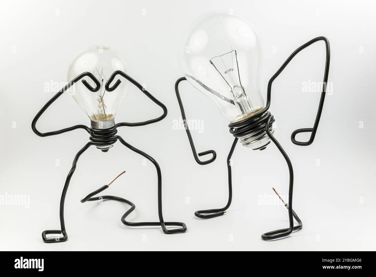 Two emotional fantasy figures of transparant light bulbs and black ...