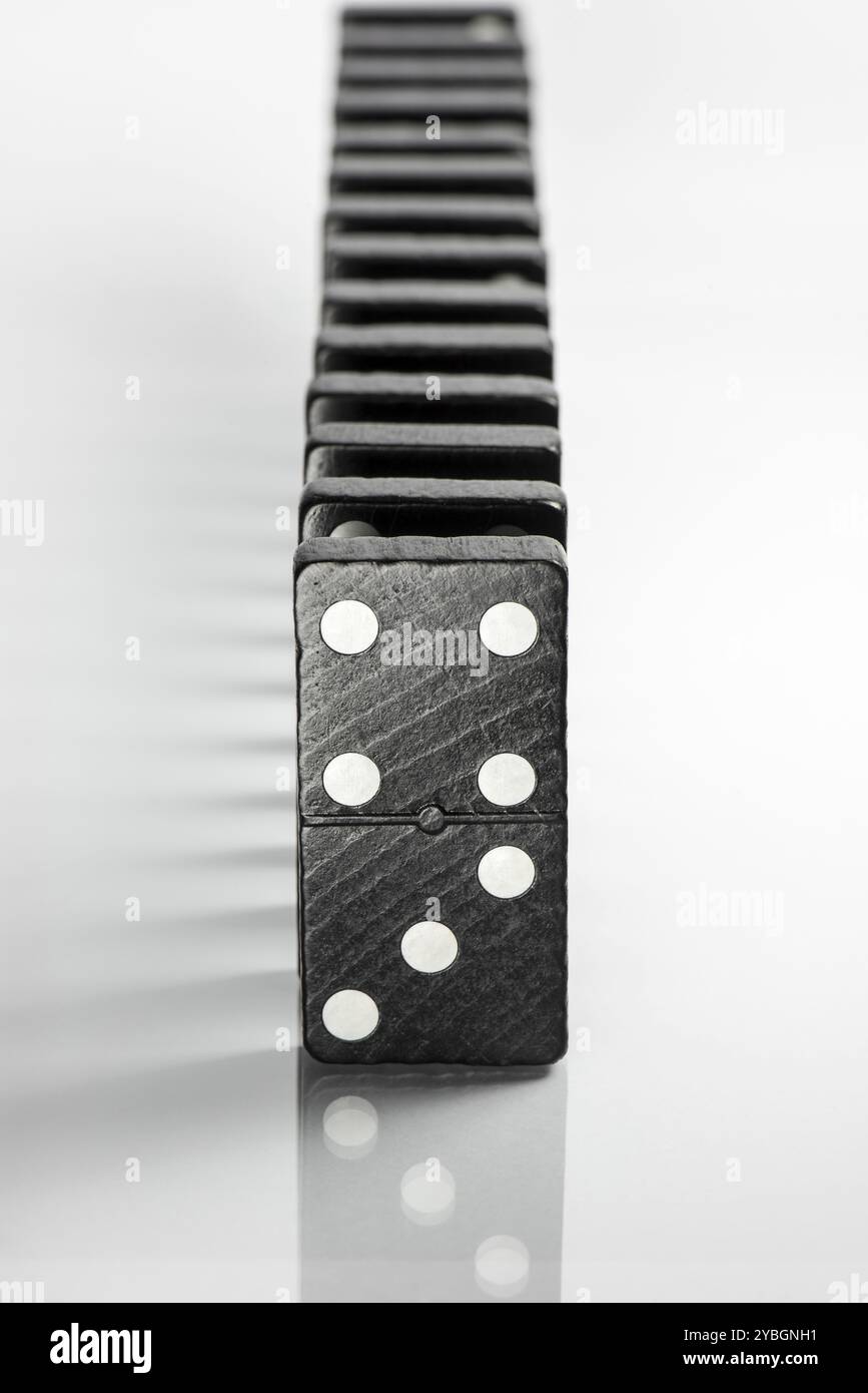 Composition of standing black domino bricks with white dots Stock Photo ...