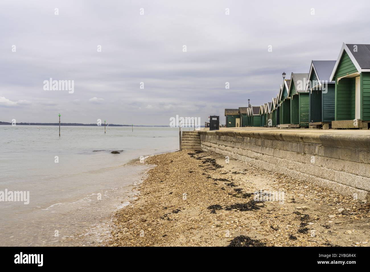 Beach huts at Gurnard Bay on the Solent coast, Isle of Wight, England ...