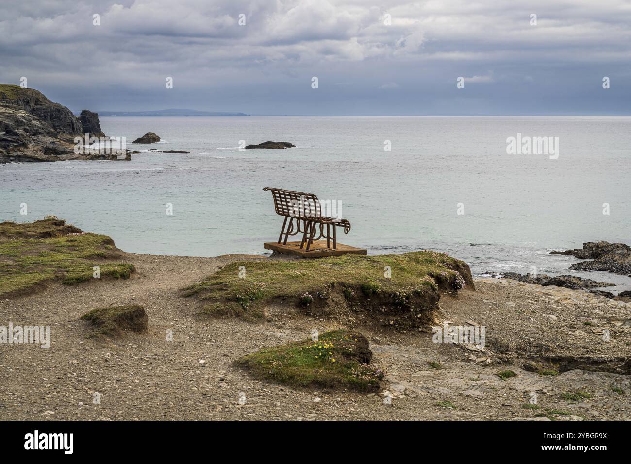 An old rusty bench in Treyarnon Bay, Cornwall, England, UK Stock Photo ...