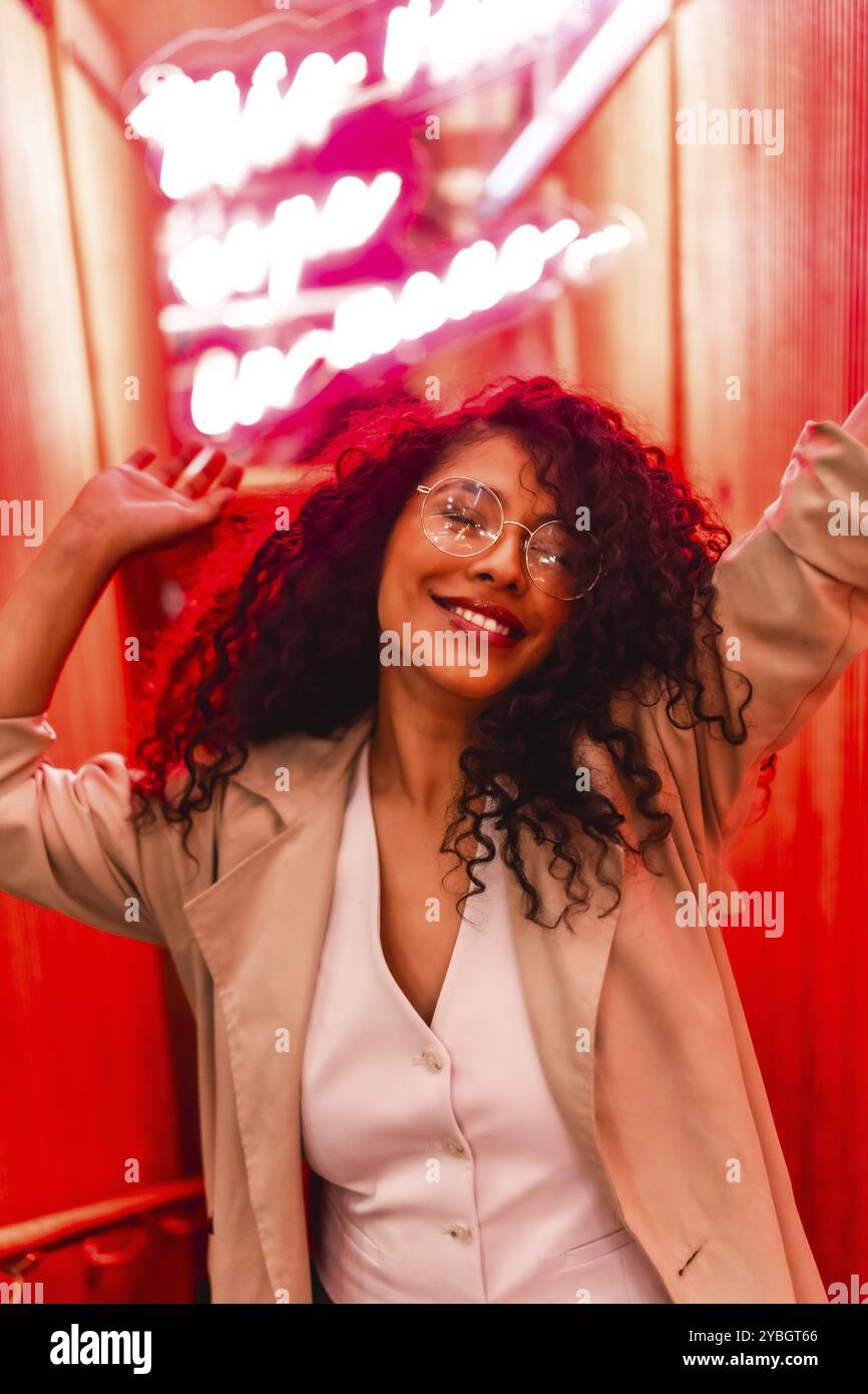 Vertical portrait of a happy beautiful latin woman with chic clothes ...