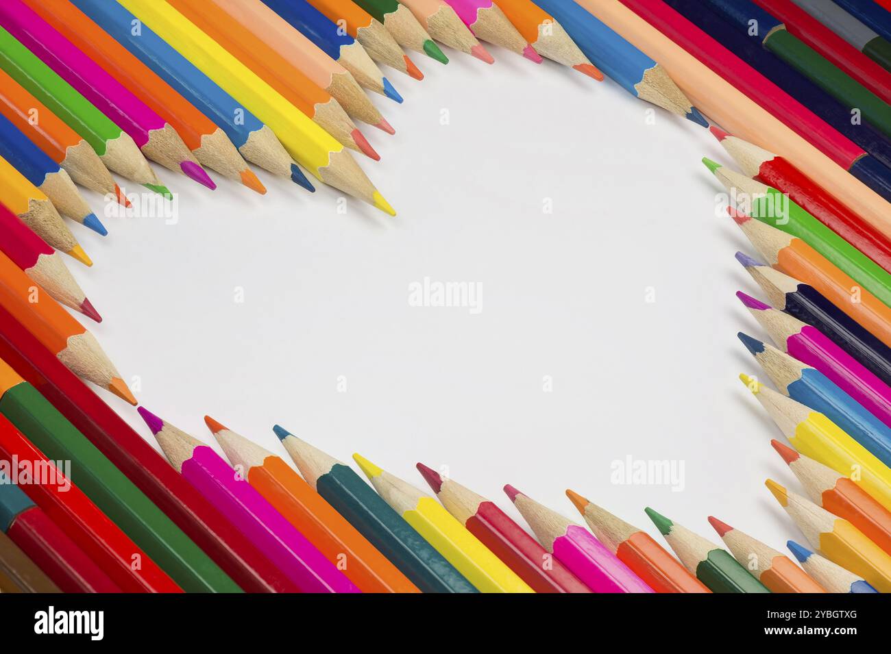 Collection of colorful pencils as a background picture in a heart shape ...