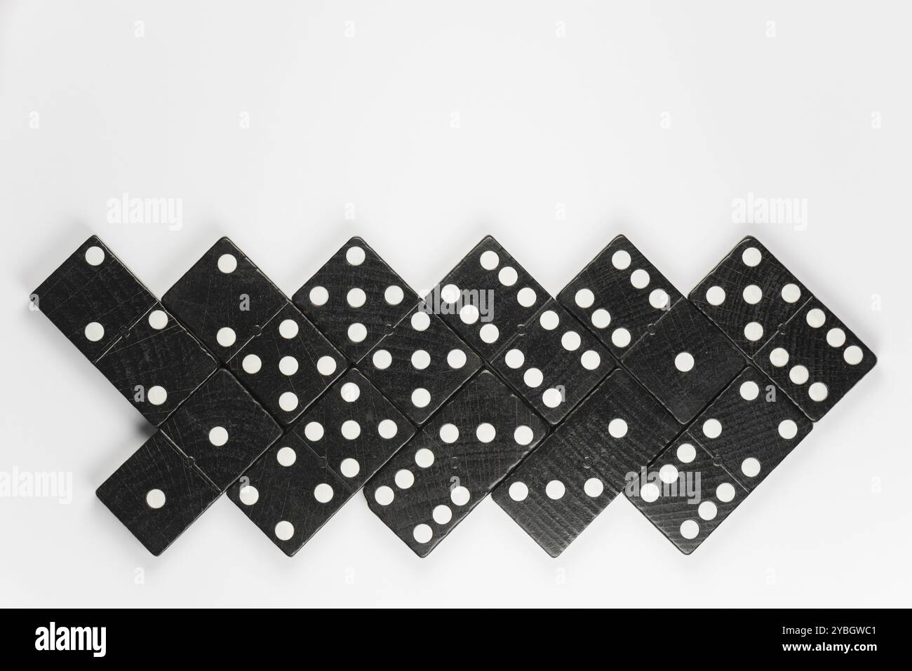Composition of lying black domino bricks with white dots Stock Photo ...