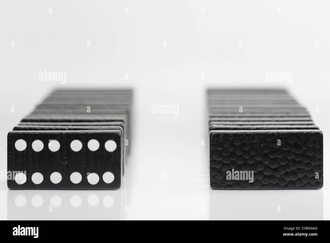 Composition of standing black domino bricks with white dots Stock Photo ...