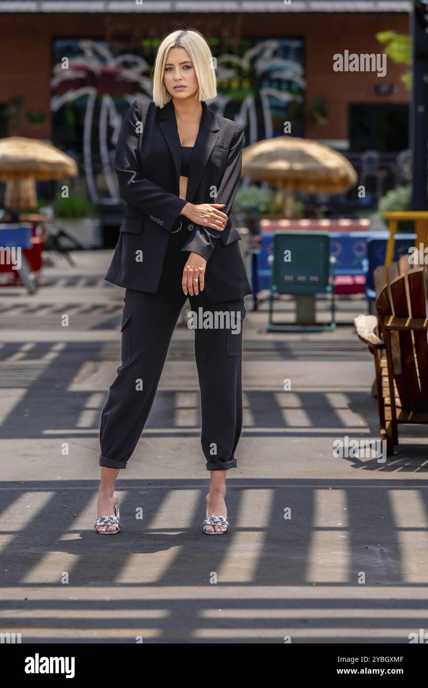 A gorgeous blonde model poses outdoors while enjoying the summer ...