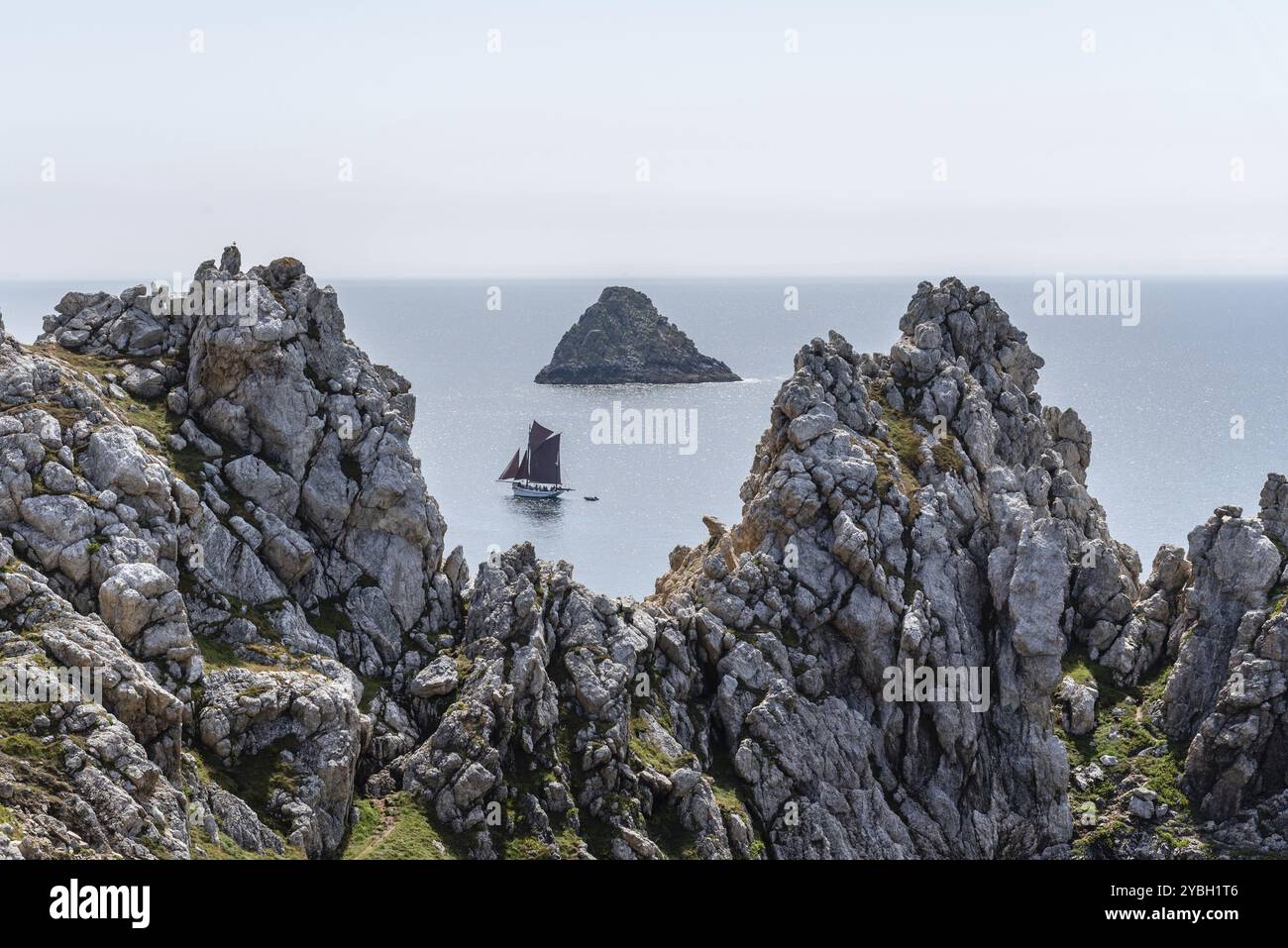 Sailboat sailing in the sea among rocks at Point of Pen-Hir, Pointe de ...