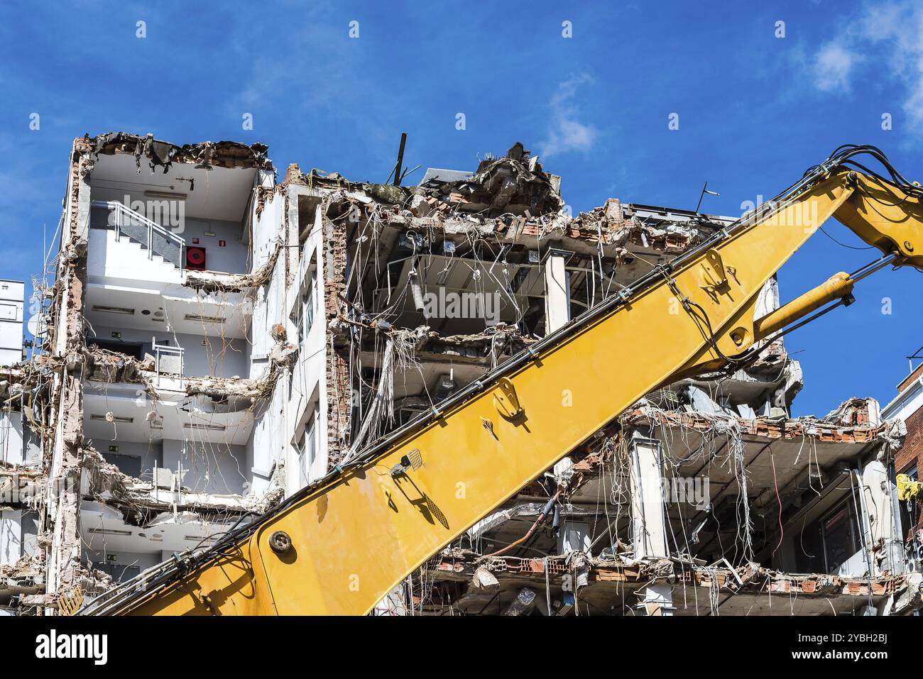 Demolition work of office building a sunny day Stock Photo - Alamy