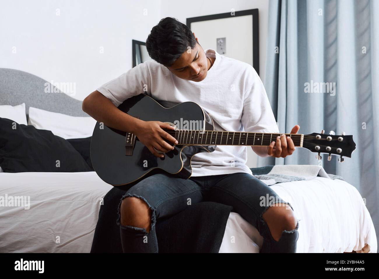 Playing, practice and man with guitar in bedroom for music, song and ...