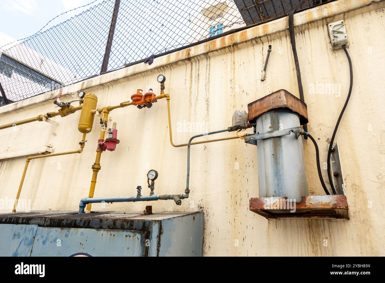 Gas pipe, gas pipes system, backyard wall in alley, residential ...