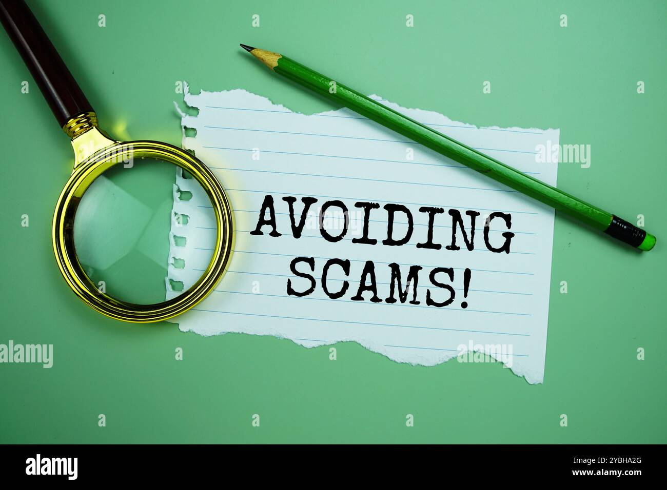 Avoiding Scam! quotes text on paper torn with magnifying glass top view ...