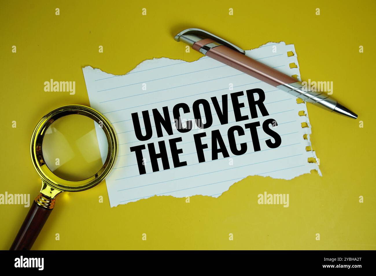 Uncover the facts quotes text on paper torn with magnifying glass top ...