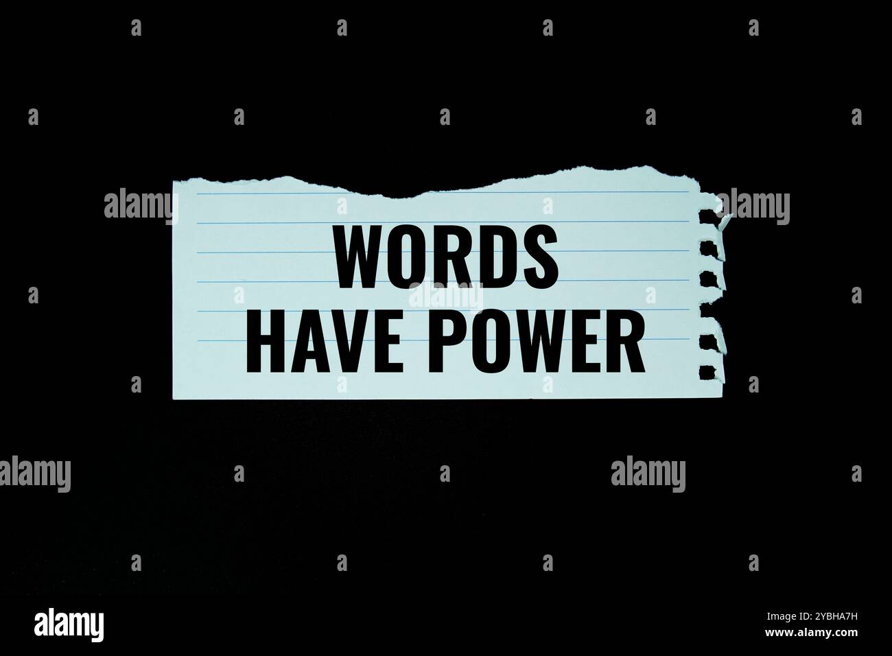 Words have power text written on paper torn top view on black ...