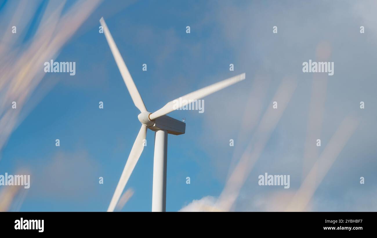 Wind turbine blue sky background hi-res stock photography and images ...