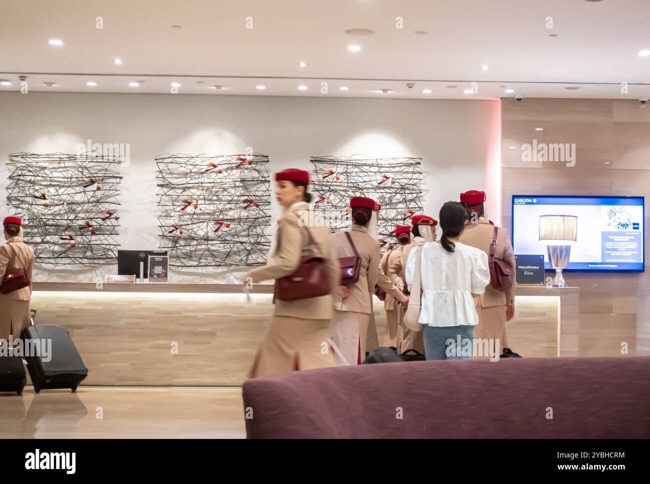 Emirates Airline Crew Members at the lobby, reception desks of the ...