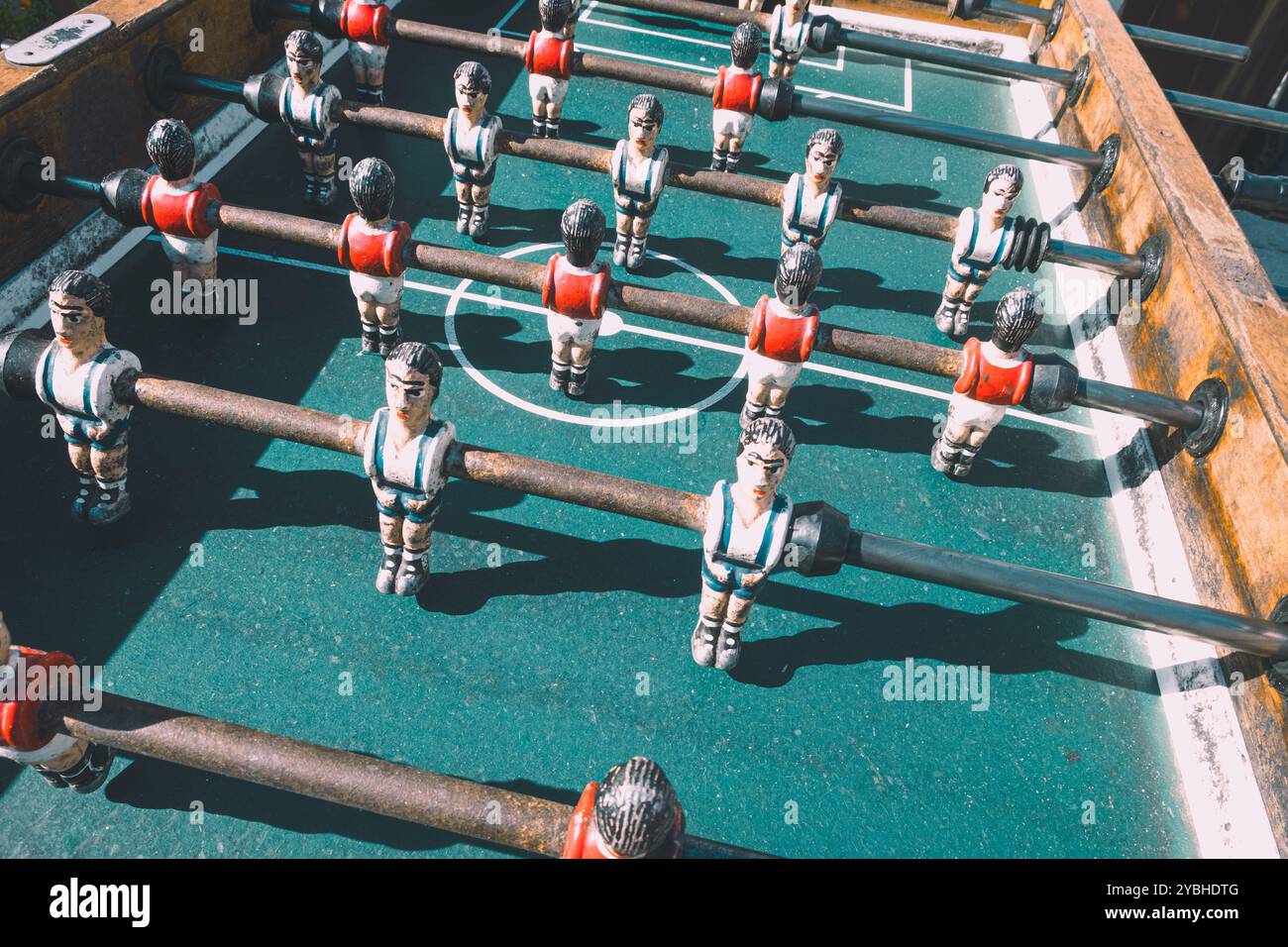 A close-up view of the table football game of football figures on the ...